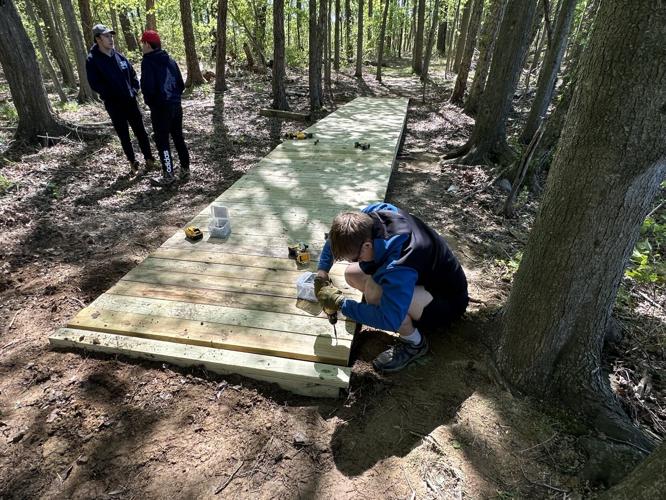 Eagle Scout boardwalk connects community mountain biking trails ...