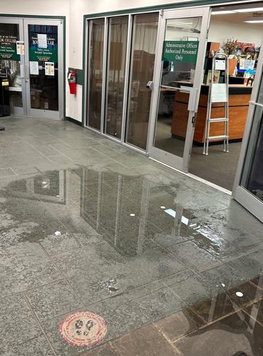 Cambridge library cleaning up after storm flooding | News ...