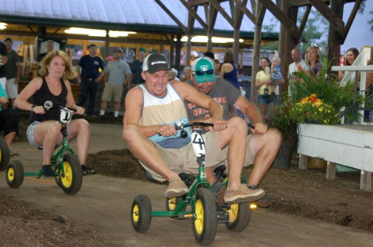 Adults compete in Tricycle Races at QA Fair | News | myeasternshoremd.com
