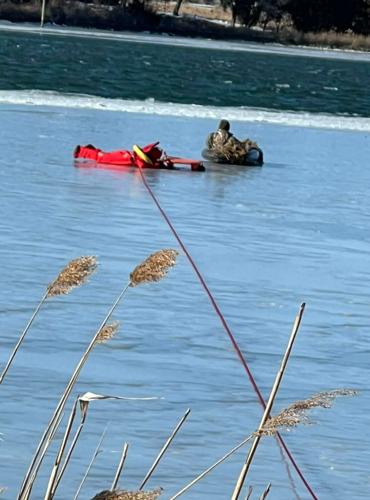 Firefighter crawls 350 feet across ice to rescue stranded hunter | News ...