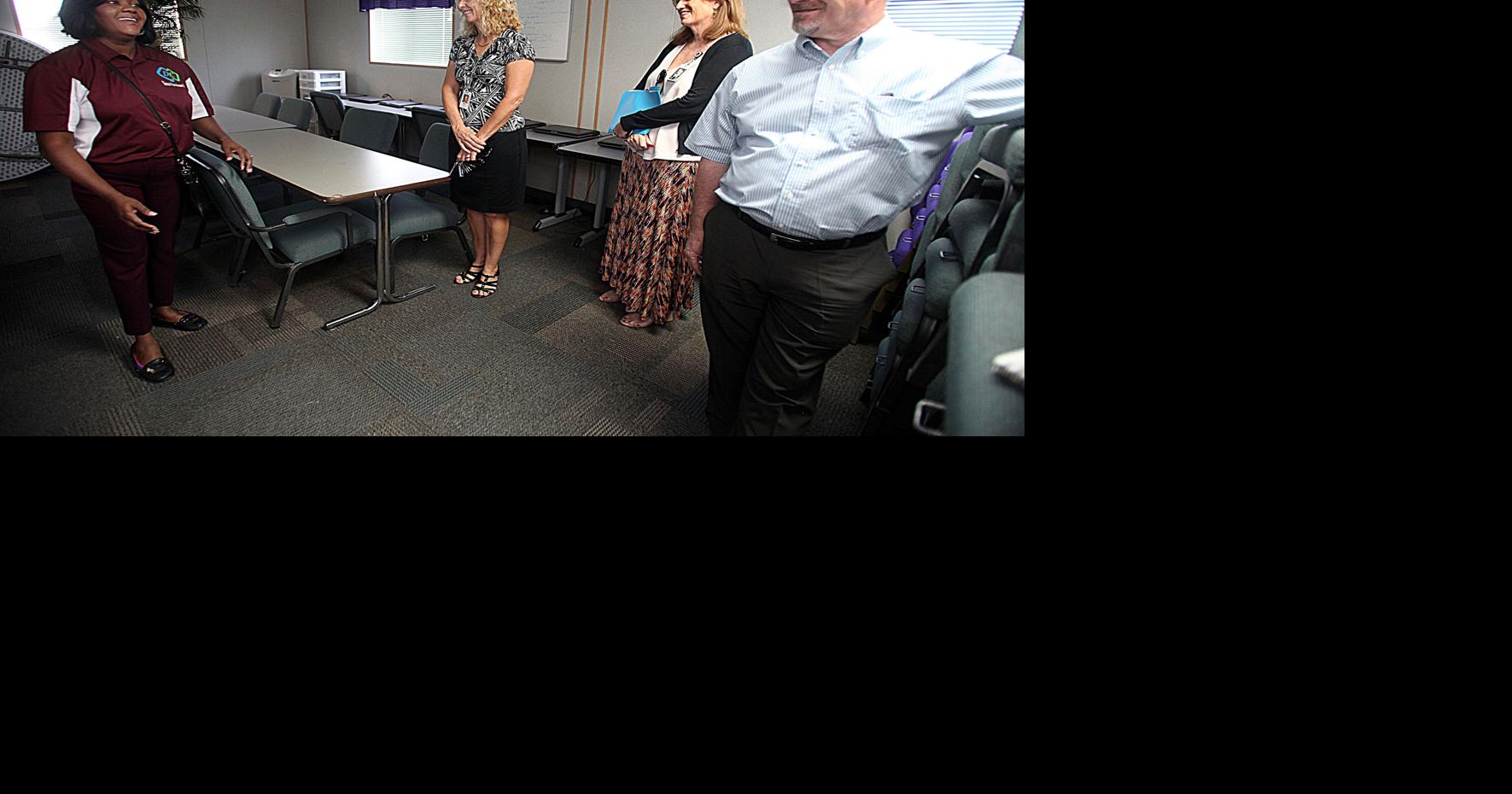 Sierra Vista Dream Center Director Ramona McCaa (left) gives members of ...