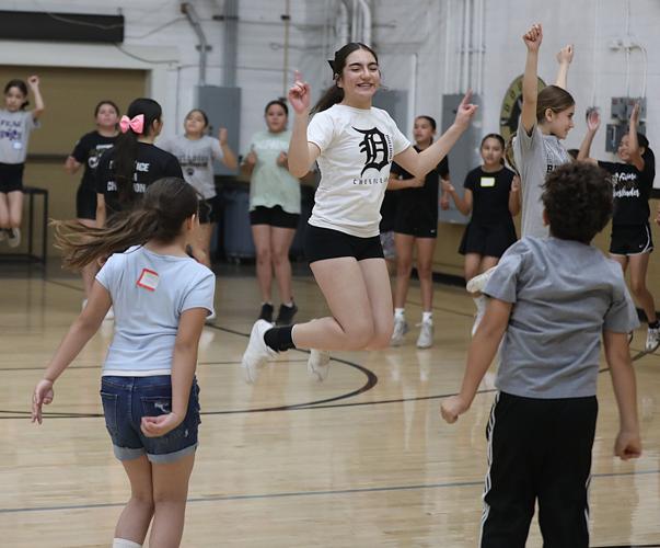 Douglas alum Erika Urquijo-Ruiz returns to lead Bulldogs cheer program ...