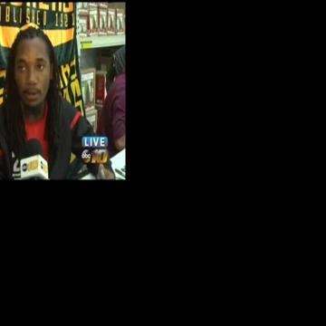 Escanaba police & Packers’ Davon House help out “Toys for Tots ...