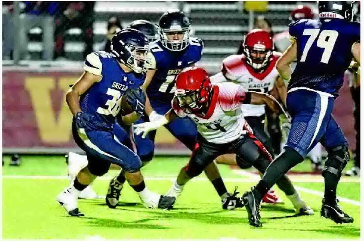 Grizzlies rush for 299 to give head coach first win