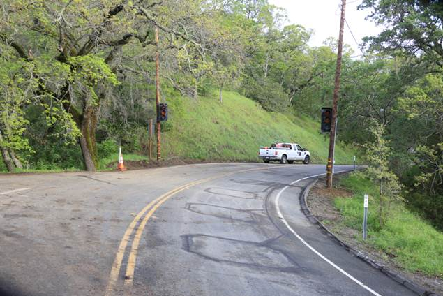 Highway 121 was set to reopen to one-way traffic Friday evening