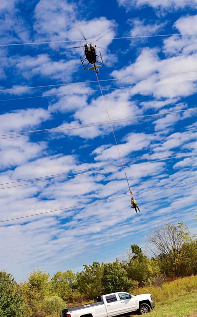 WATCH VIDEO: Linemen dangling from helicopters bring electric upgrade ...