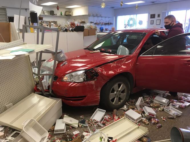 No one hurt when car crashes through Jameson's Candy | Local News ...