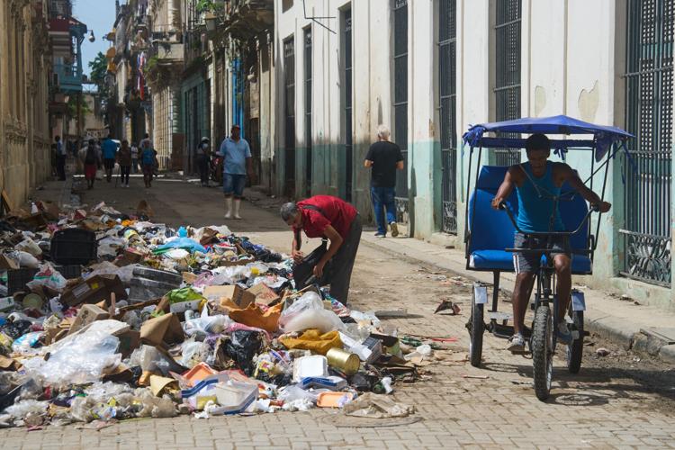 A garbage crisis engulfs Havana as fuel shortages stall trash pickup ...