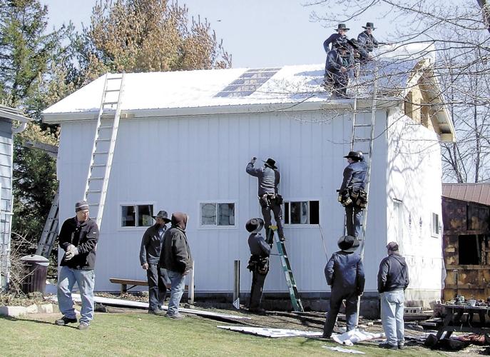 Good neighbors: Amish residents rebuild a saw-sharpening shop destroyed ...
