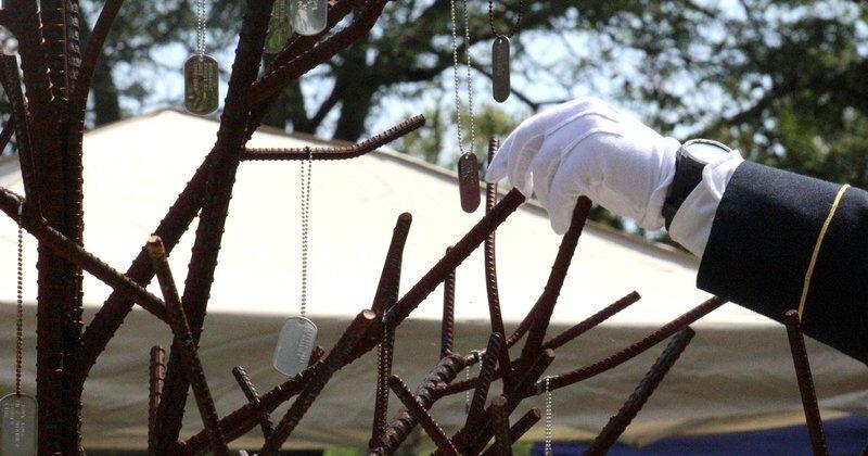 Dog tag tree rededicated during ceremony | Local News | ncnewsonline.com