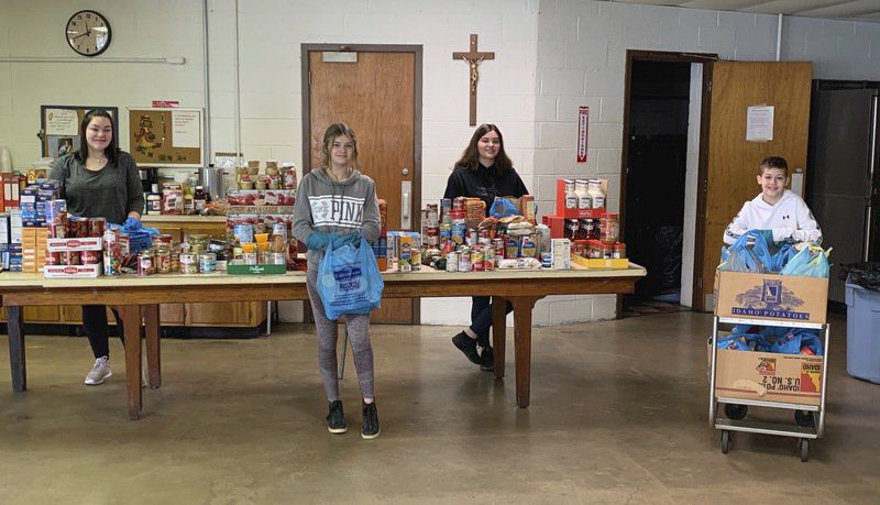 Family collects food for Holy Spirit pantry | Local News | ncnewsonline.com
