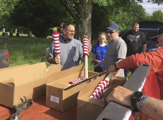 Families pass down tradition of placing flags at cemetery | Local News ...