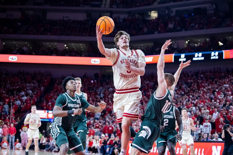 PHOTO: Court storm in Lincoln, Huskers survive Spartans in thriller ...