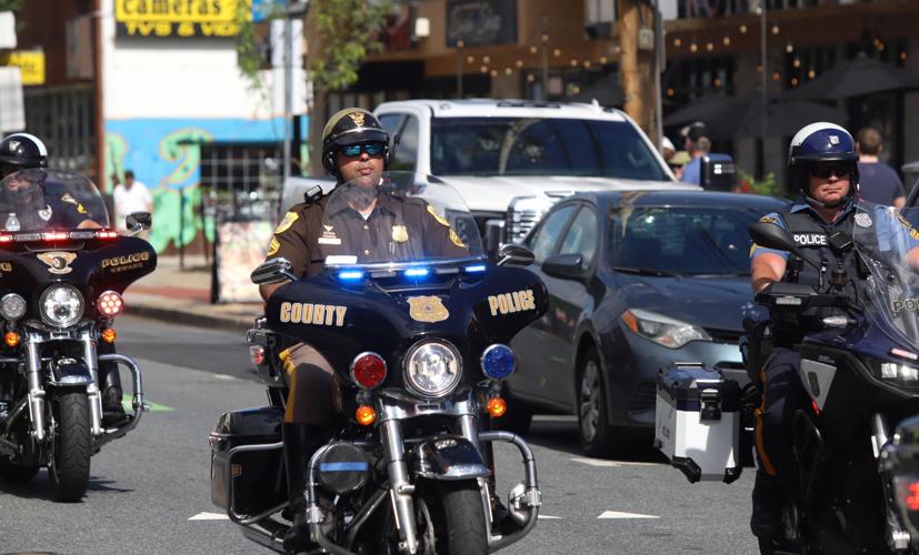 Police officers carry Special Olympics torch down Main Street | News ...