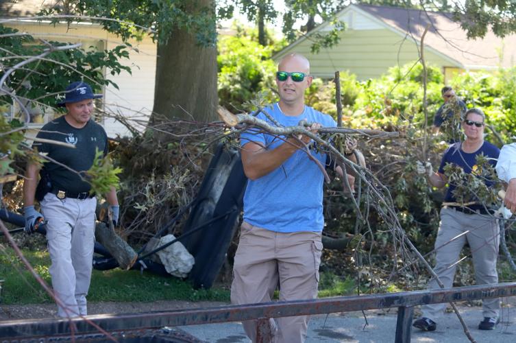 Volunteers help clean up storm debris in Brookside, Cherokee Woods ...