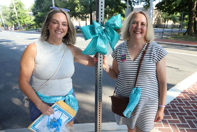 Volunteers 'turn the town teal' for ovarian cancer awareness | News ...