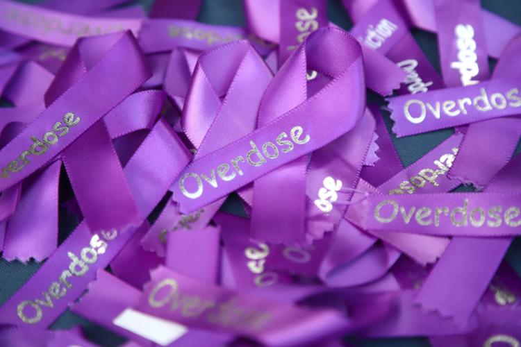 Main Street vigil remembers overdose victims, fights against the stigma ...