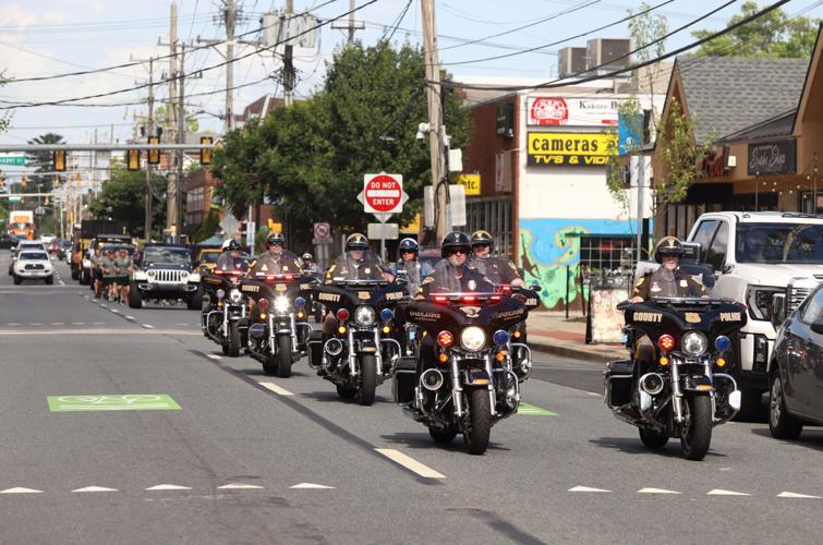 Police officers carry Special Olympics torch down Main Street | News ...