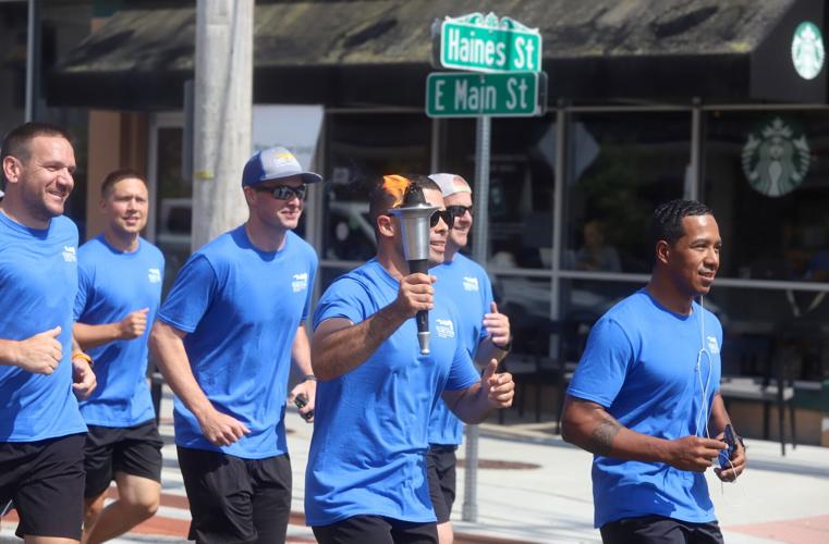 Special Olympics torch carried down Main Street | News ...