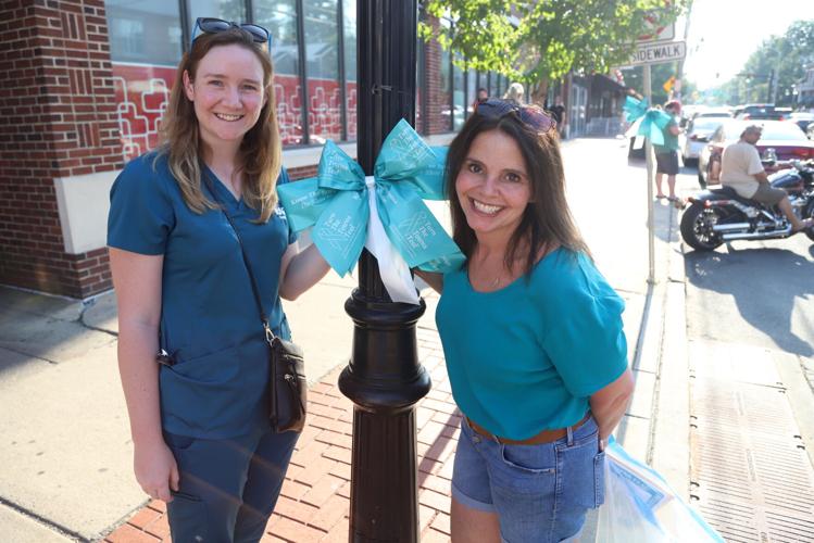 Volunteers 'turn the town teal' for ovarian cancer awareness | News ...