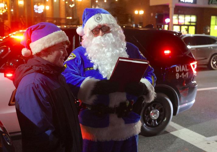 Sgt. Santa hands out presents on Main Street | News Gallery ...