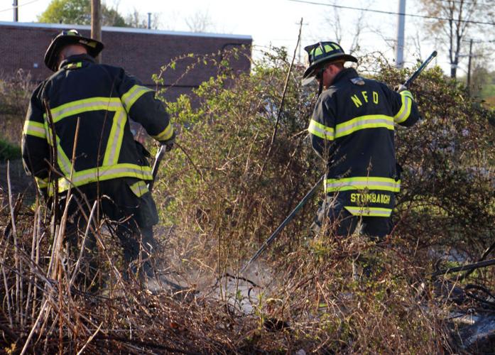 Aetna firefighters extinguish brush fire behind Main Street businesses ...