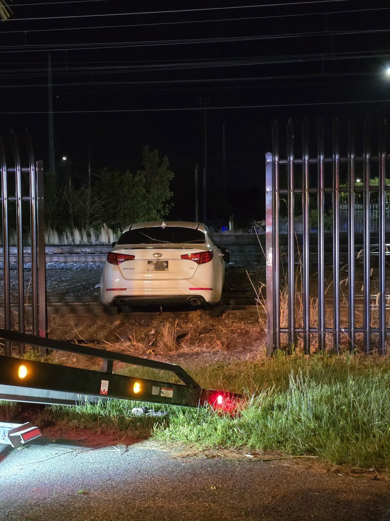 Police: Drunken driver crashed through fence, drove on to train tracks ...