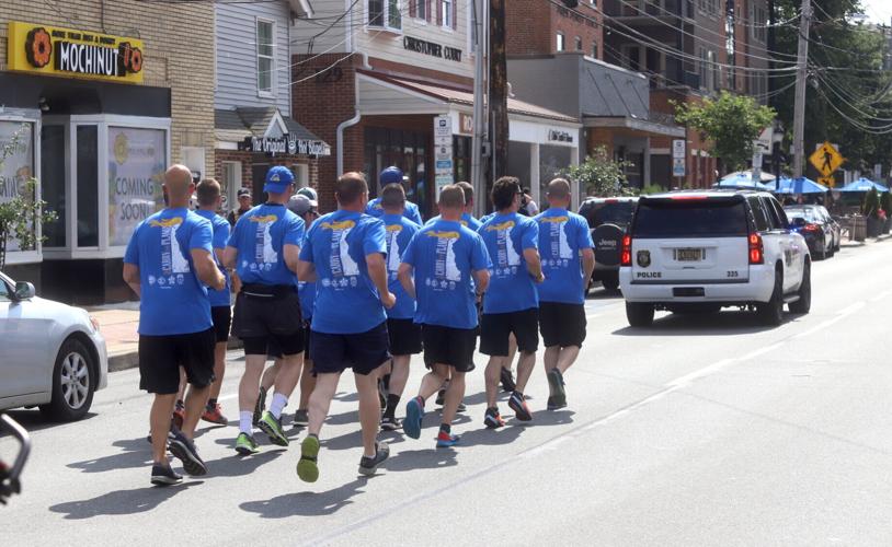 Special Olympics torch carried down Main Street | News ...