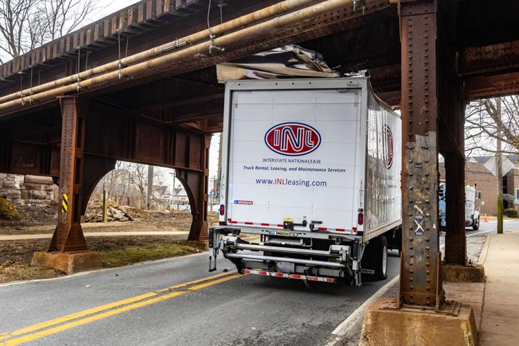 Driver cited after getting truck stuck under North Chapel Street bridge ...