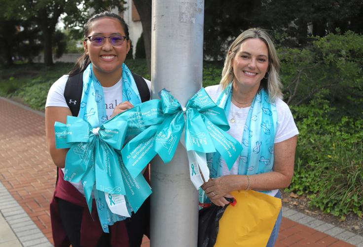Volunteers 'turn the town teal' for ovarian cancer awareness | News ...