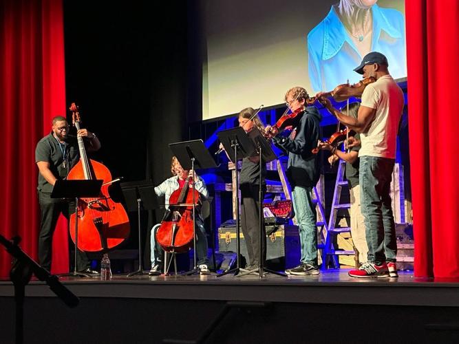 Author visits Newark Charter, performs with orchestra students | News ...