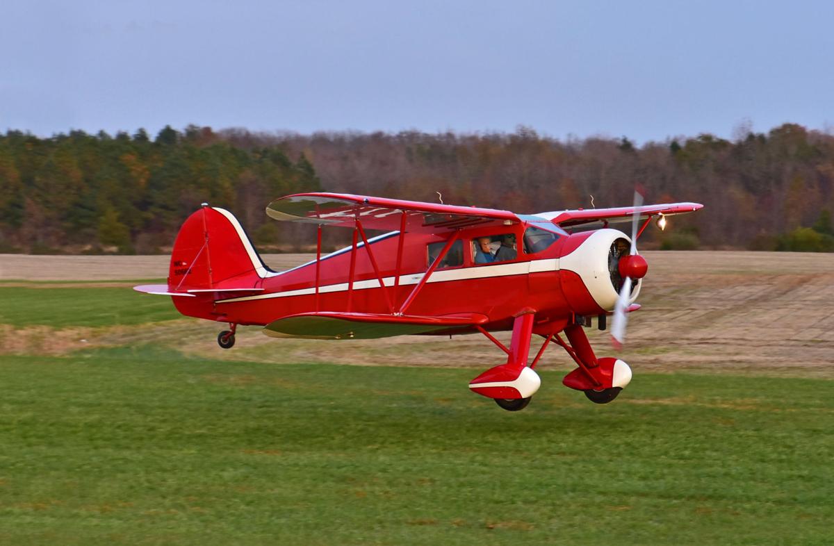 1939 WACO ZKS-7 (Cabin Biplane) lands at Massey Aerodrome where it is ...