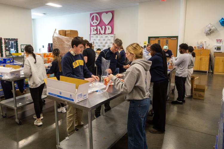 'Spirit of community': Food Bank volunteers pack meal kits during MLK ...