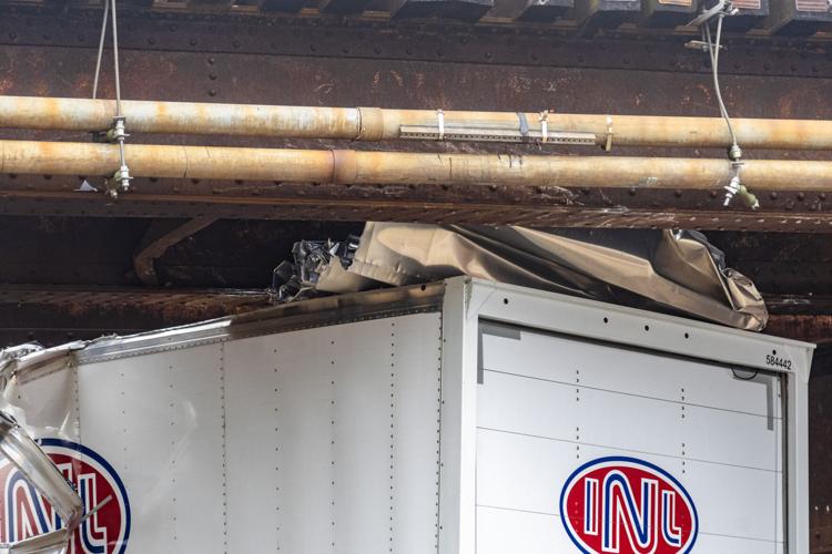 Driver cited after getting truck stuck under North Chapel Street bridge ...