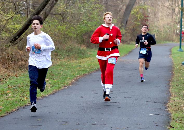 Runners don colorful costumes for annual Santa Cause 5K | Gallery ...