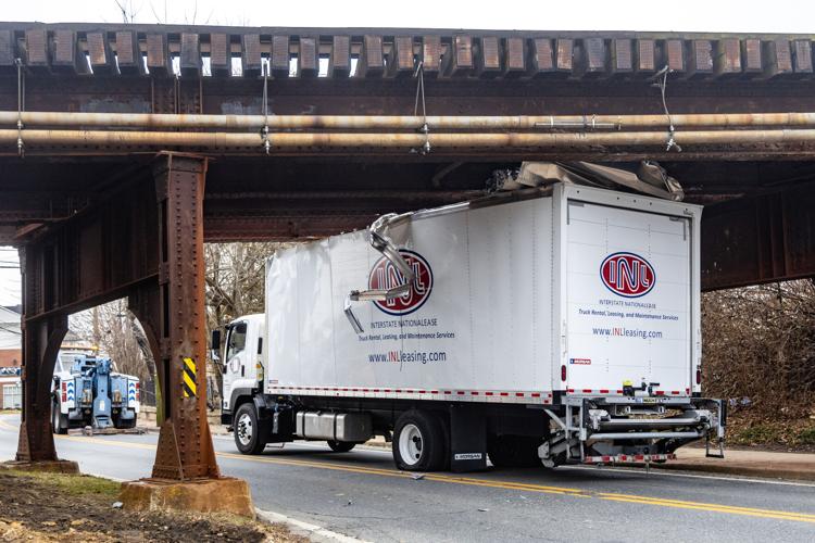 Driver cited after getting truck stuck under North Chapel Street bridge ...