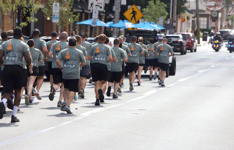 Police officers carry Special Olympics torch down Main Street | News ...