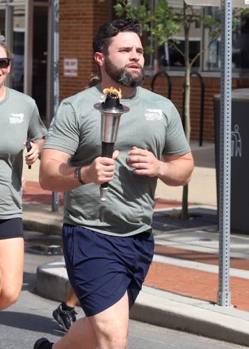 Police officers carry Special Olympics torch down Main Street | News ...