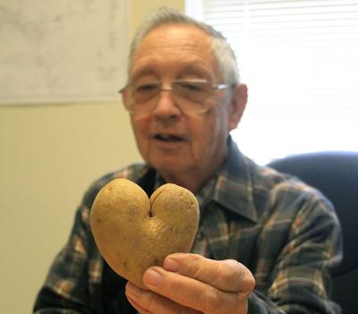 New Bern man eyes a heart-shaped potato | Local News | newbernsj.com