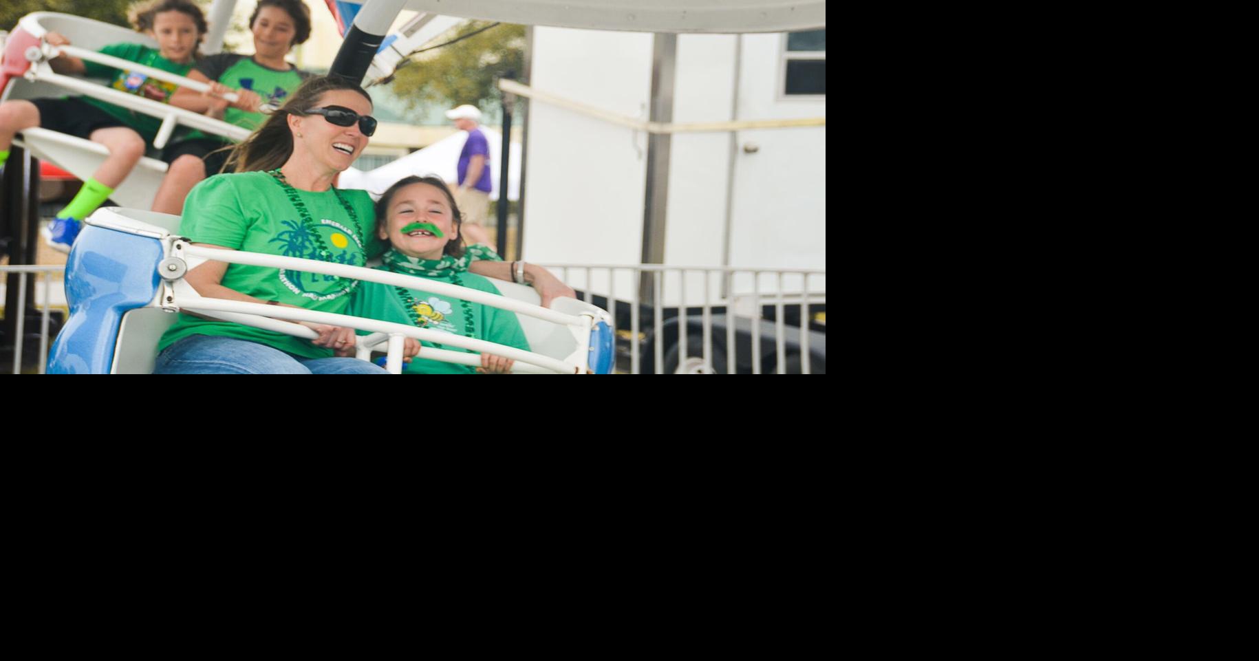 Kate Reardon and her daughter Amy Reardon, 7, enjoy rides together at ...
