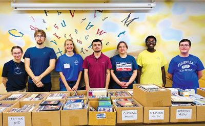 CCSU Honor Students help with New Britain library book sale | News ...