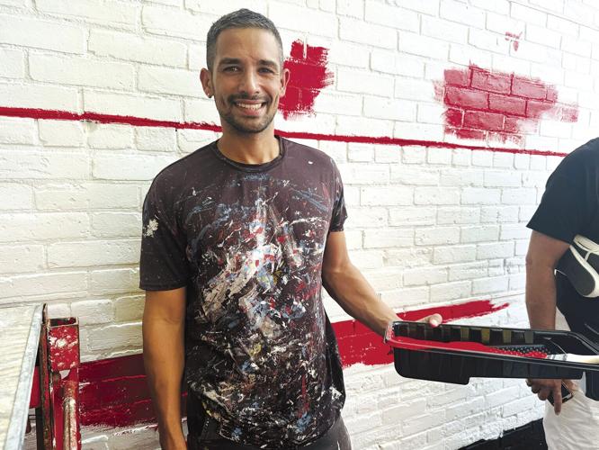 ‘Symbol of Unity’: Artist Hector PR paints at Criollisimo Restaurant ...