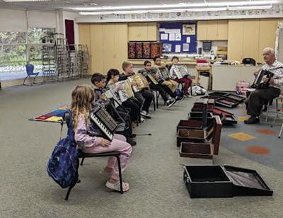 Musician hosting accordion lesson at elementary school | News ...
