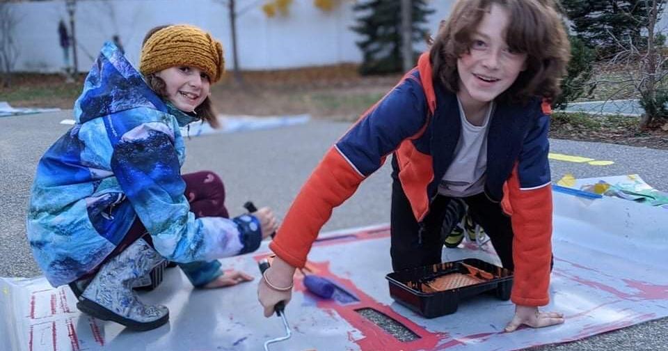 Students use stencils to paint outside Port schools | News ...