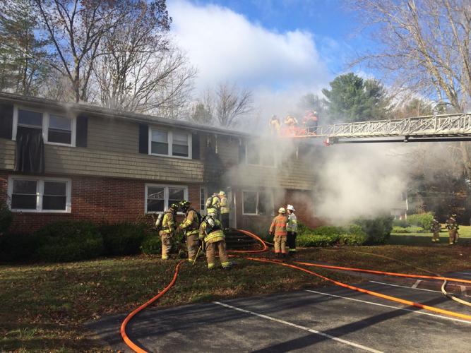 Neighbor, police help resident jump from burning Merrimac building ...