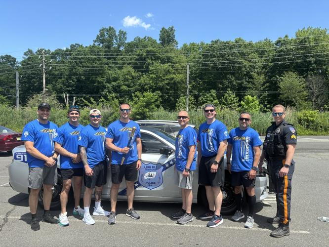 Long Hill police officers participate in the Torch Run to support ...