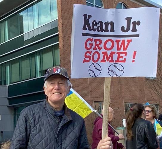 Dozens of community members protest against Trump administration in ...