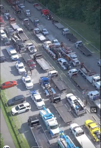 Trucks line up for funeral procession for deceased tow worker at ...