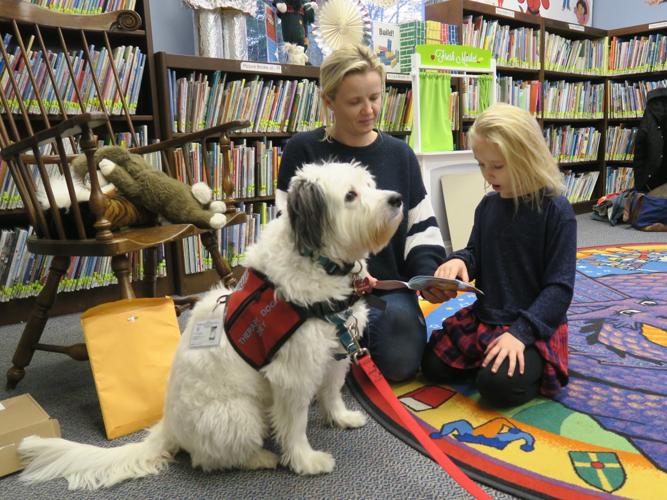 Families discover benefits of reading to therapy dogs at Watchung ...