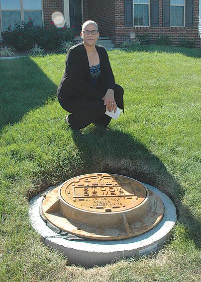 Residents want manhole in front yard made level with slope | News ...